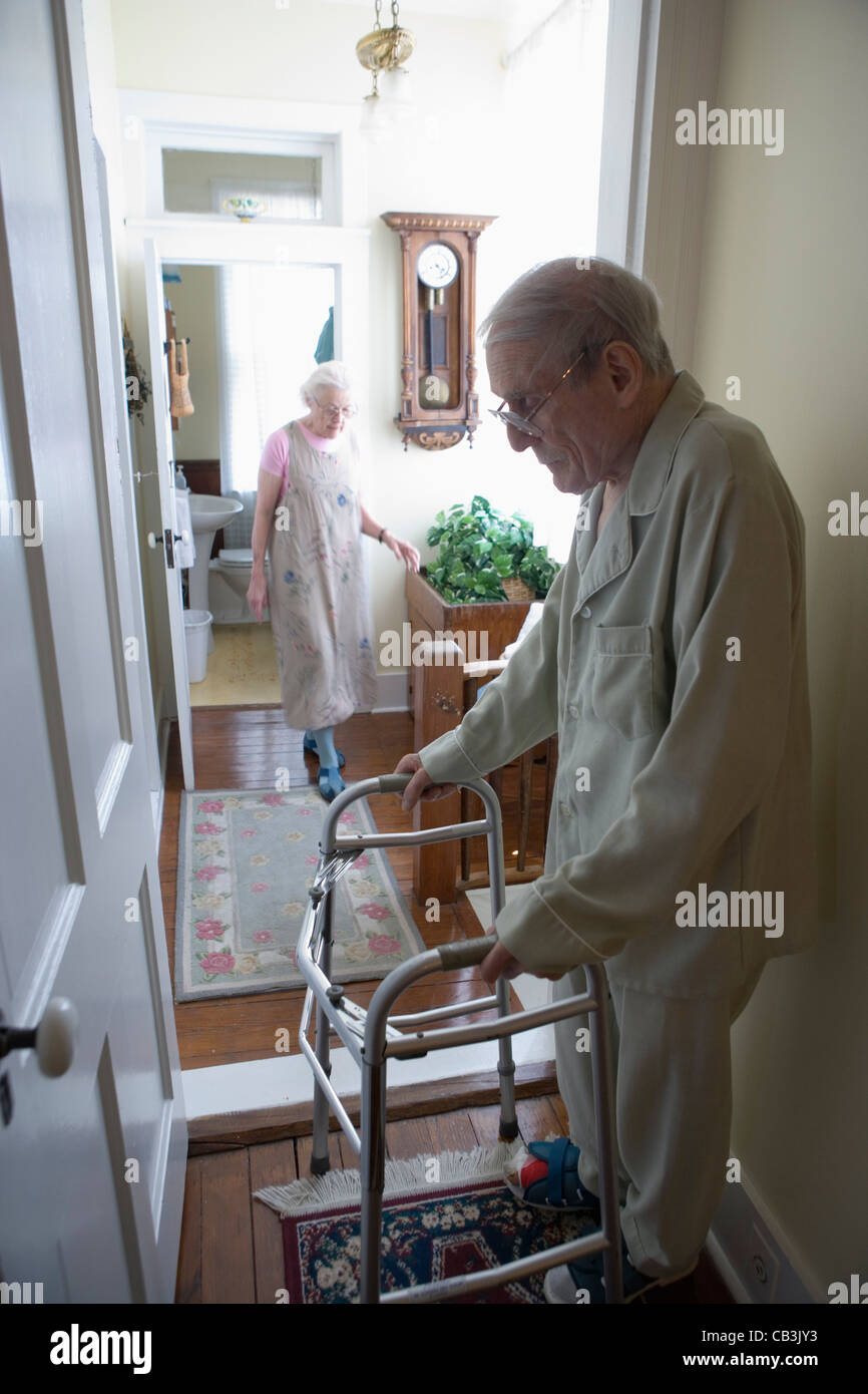 Feeble senior man standing walker hi-res stock photography and images ...