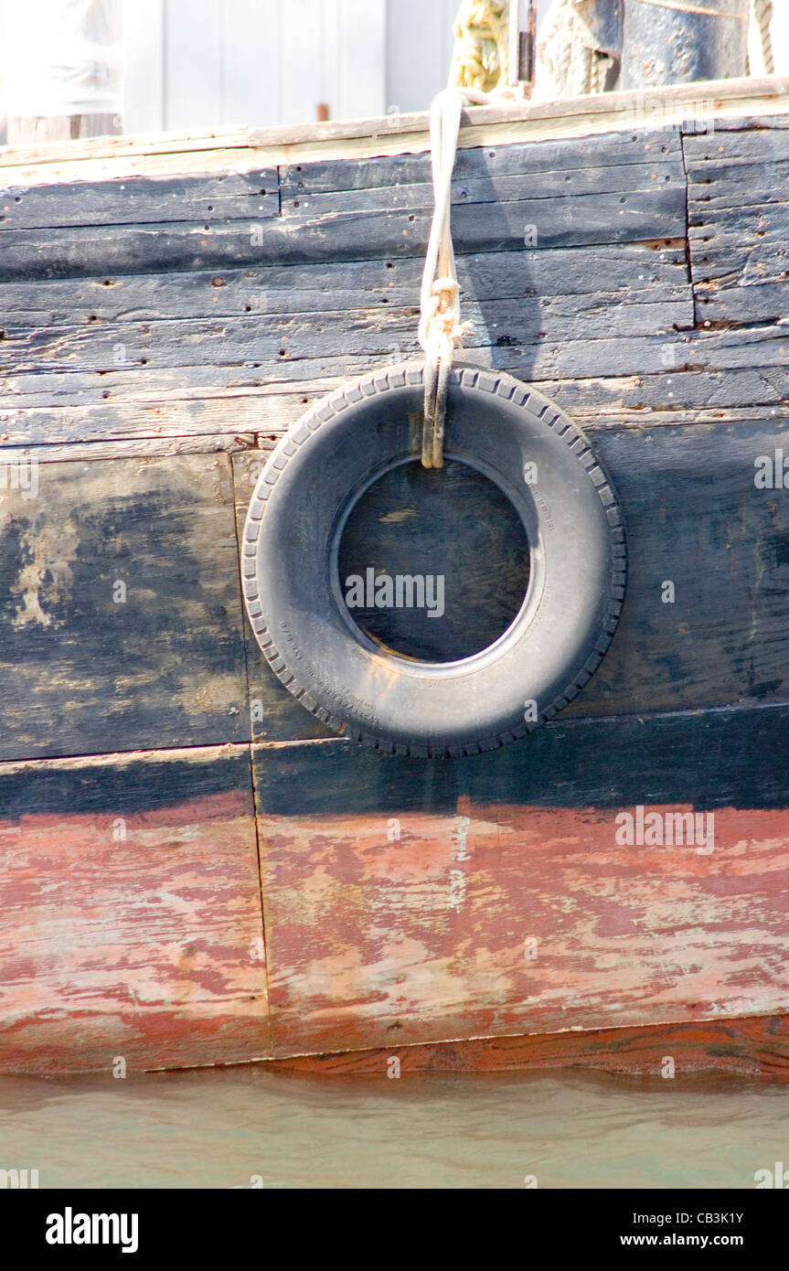 USA, Rhode Island, Newport, Tire buffer on fishing trawler Stock Photo ...