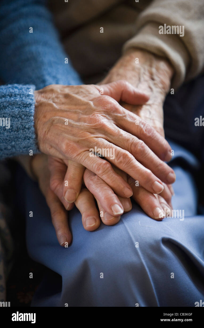 Close-up of senior couple's hands overlapping Stock Photo - Alamy