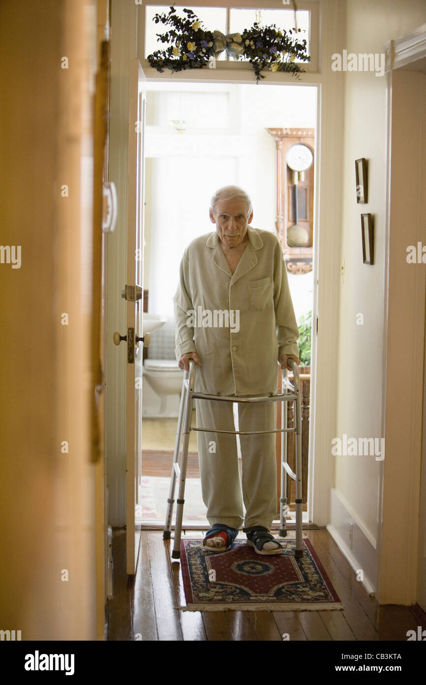Senior man using walker walking hi-res stock photography and images - Alamy