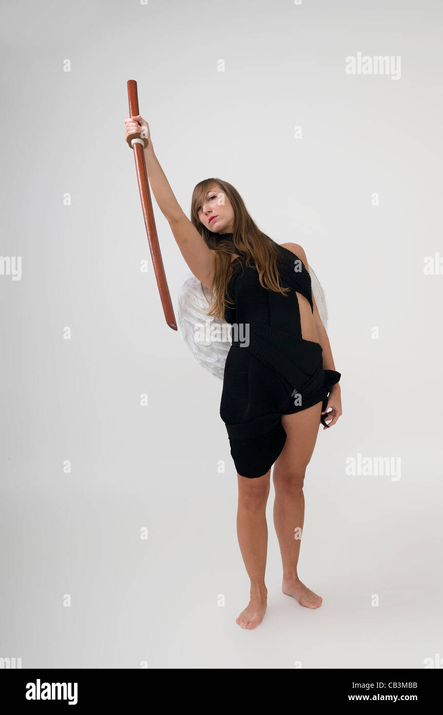 Avenging angle with a sword On white Background Stock Photo - Alamy