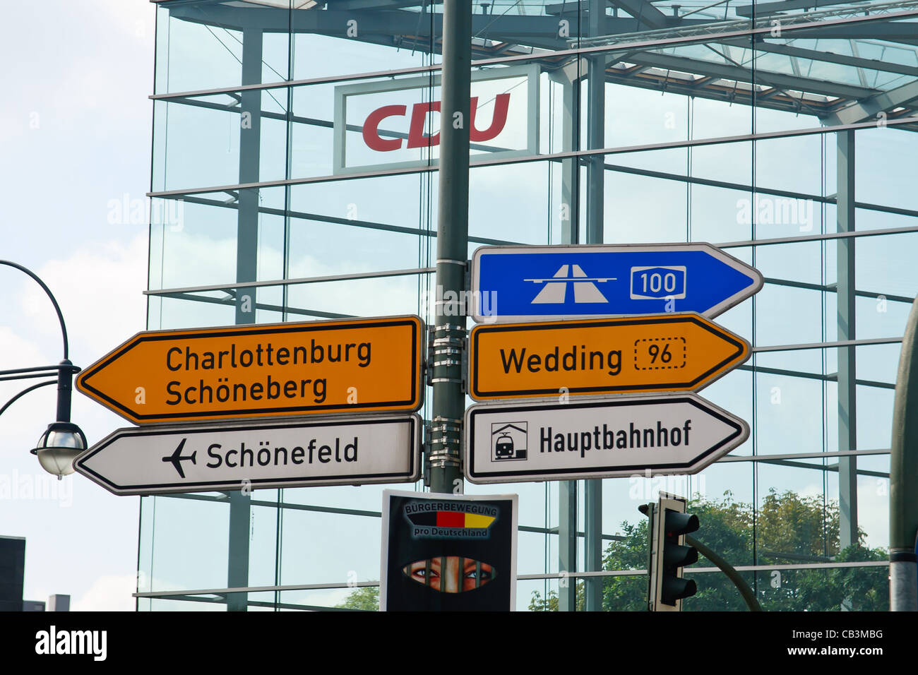 Modern sign post against glass wall. Berlin. Germany Stock Photo - Alamy