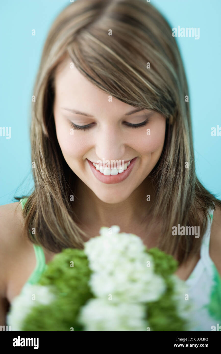 Woman smelling flowers in hi-res stock photography and images - Alamy
