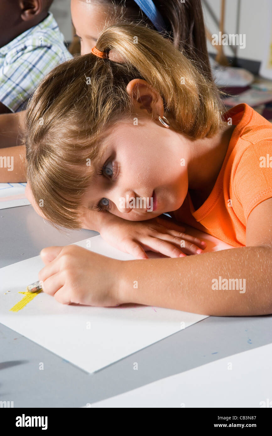 Close-up of girl drawing in class Stock Photo - Alamy