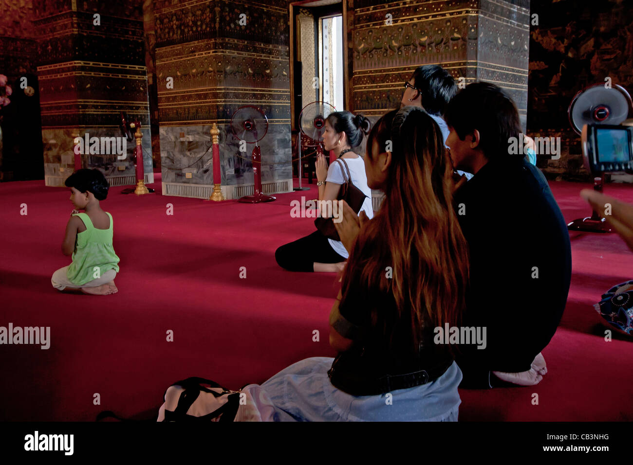 Wat Po Temple of the Reclining Buddha Bangkok Thailand prating in the ...