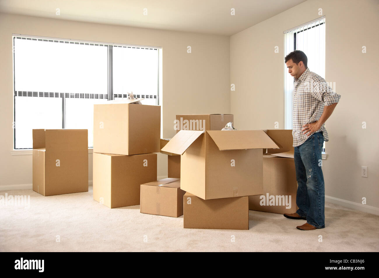 Man moving into new house Stock Photo - Alamy
