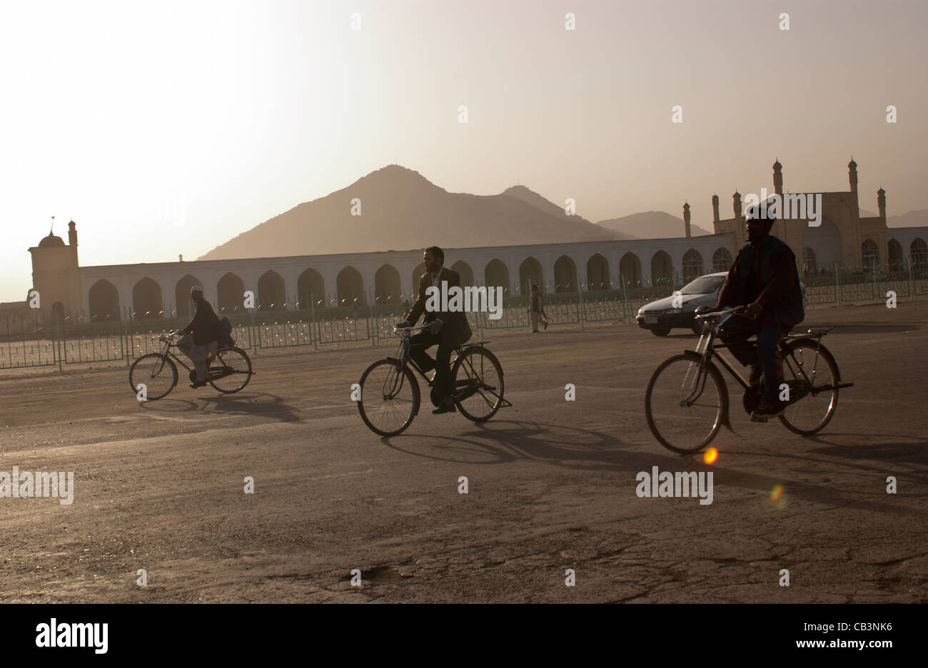 Men bicycle by the Id Gah (Eid Gah) Mosque in Kabul Afghanistan ...