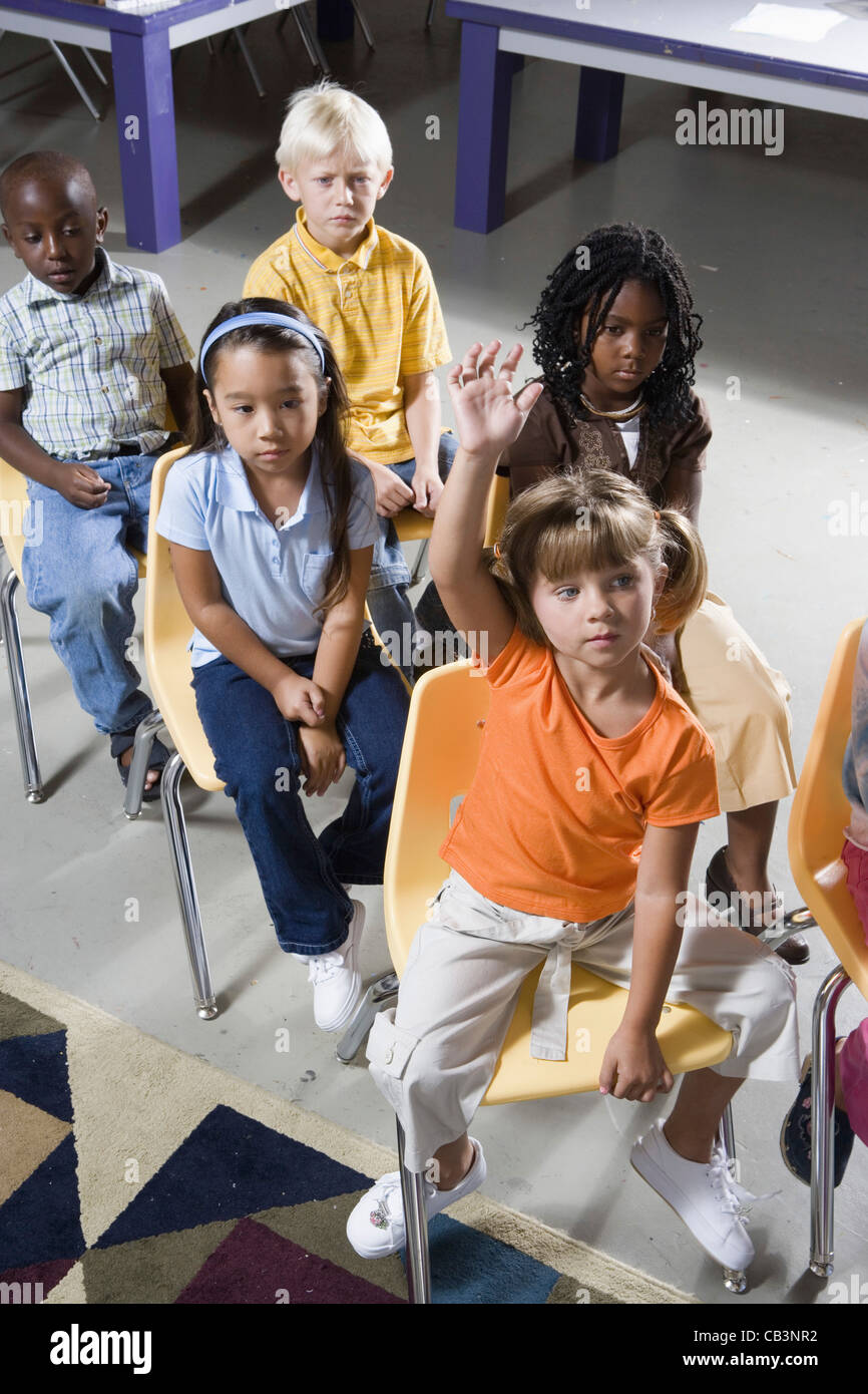 Young students sitting in a classroom Stock Photo - Alamy