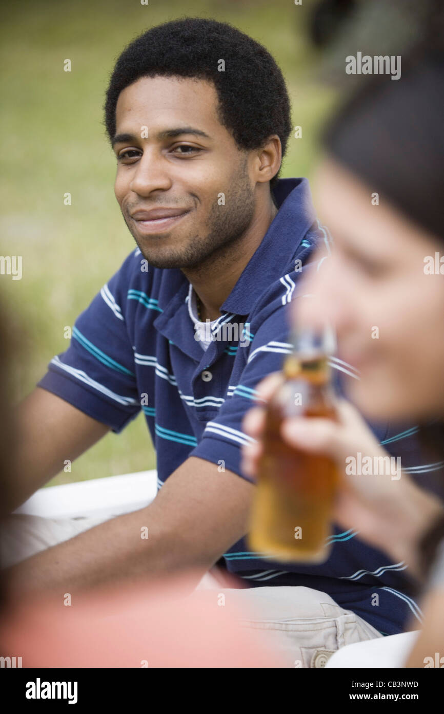 Side view of a smiling young man Stock Photo - Alamy