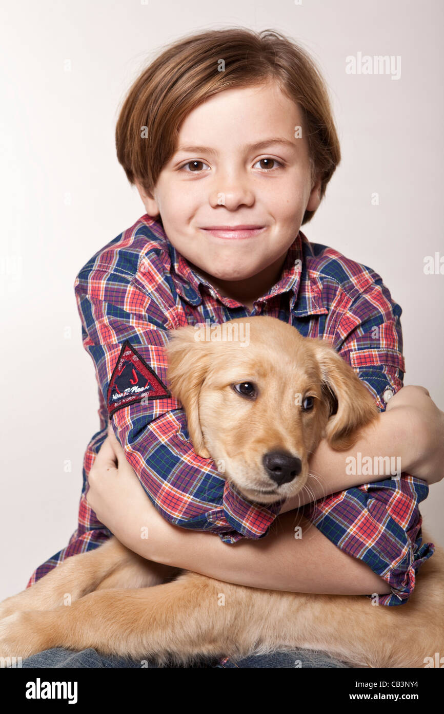 Studio shot puppy with boy hi-res stock photography and images - Alamy