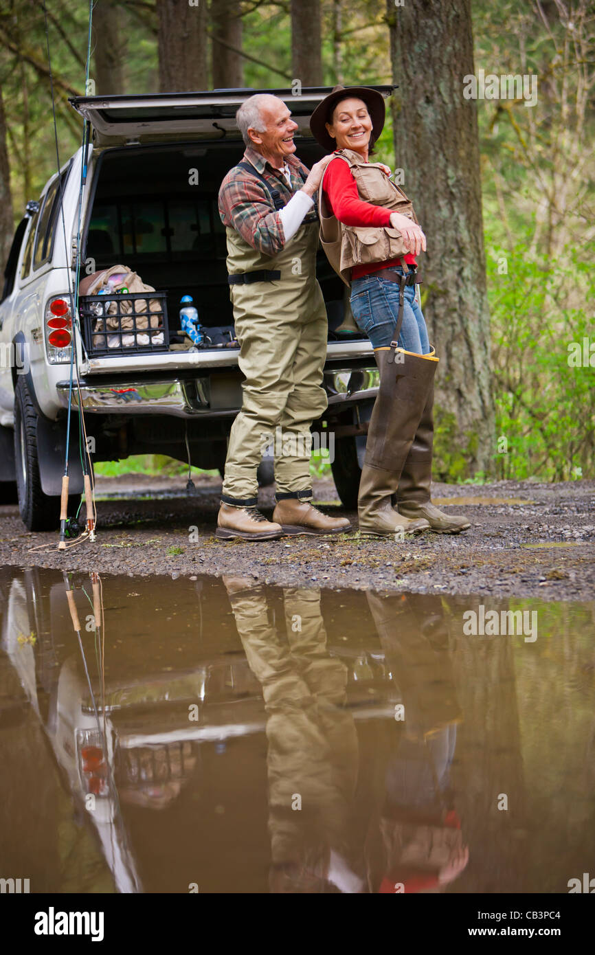 USA, Washington, Vancouver, Couple getting ready for fishing next to ...