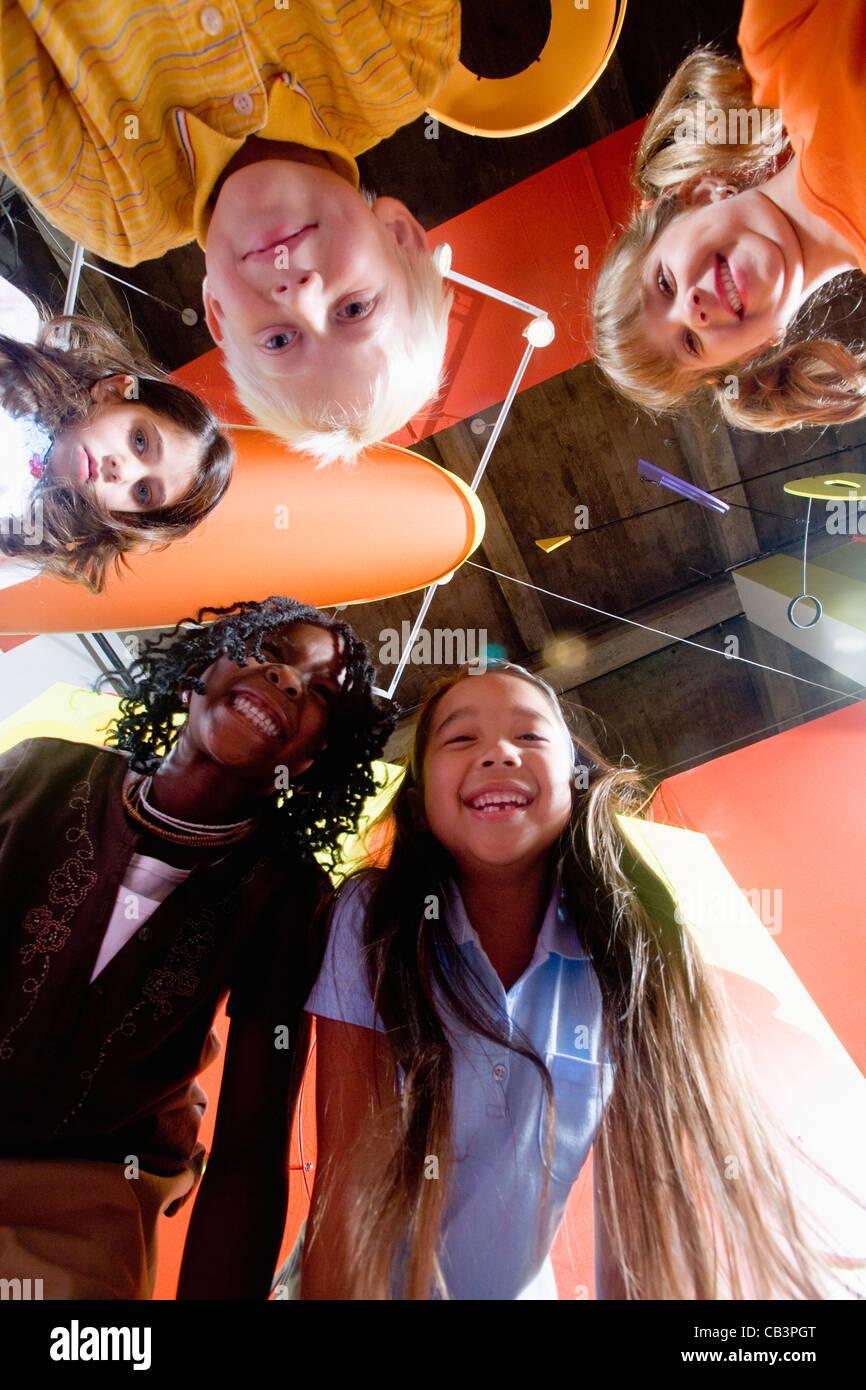 Low angle view of children in a circle looking downwards Stock Photo ...