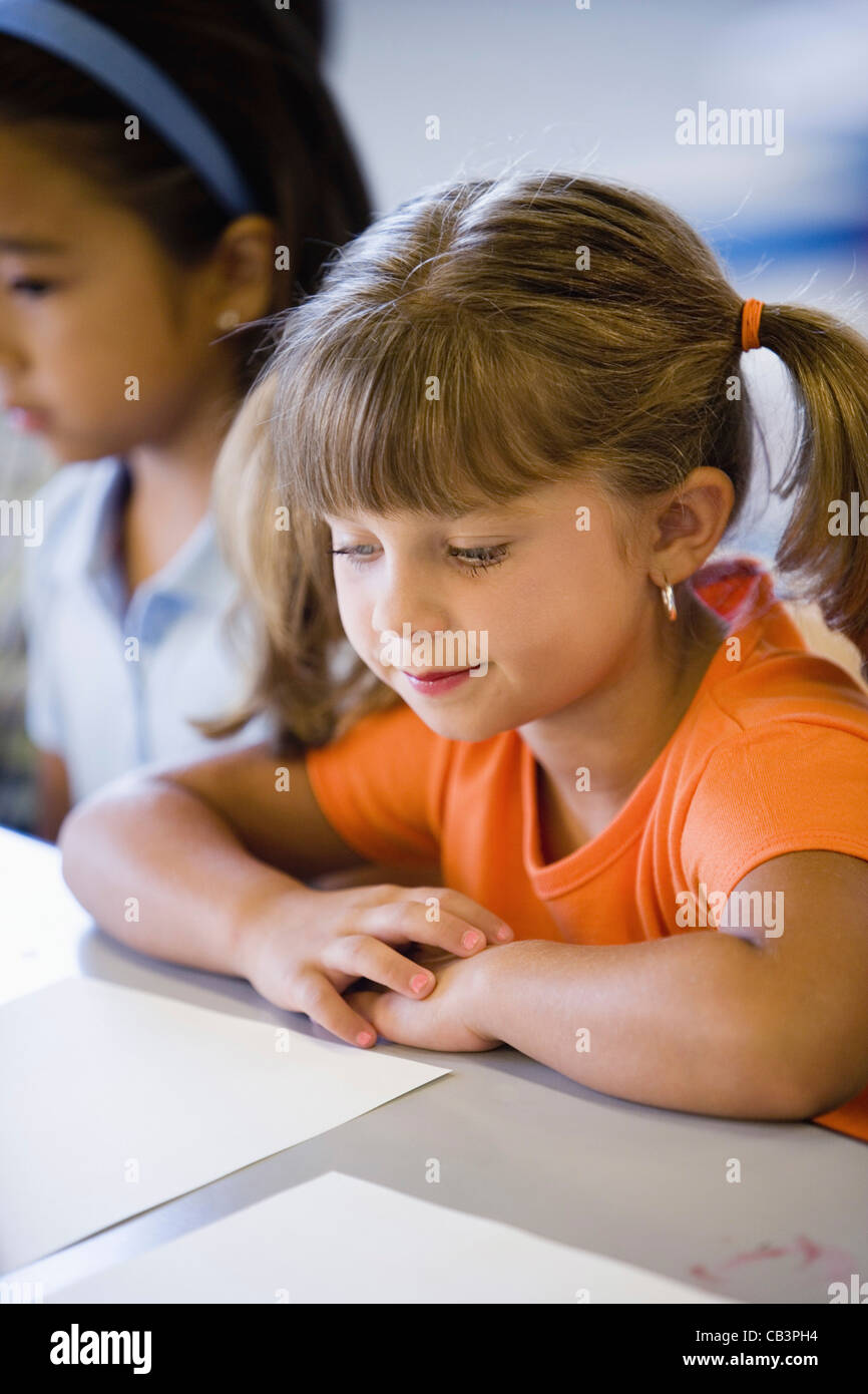 Close up of two little girls in class Stock Photo - Alamy