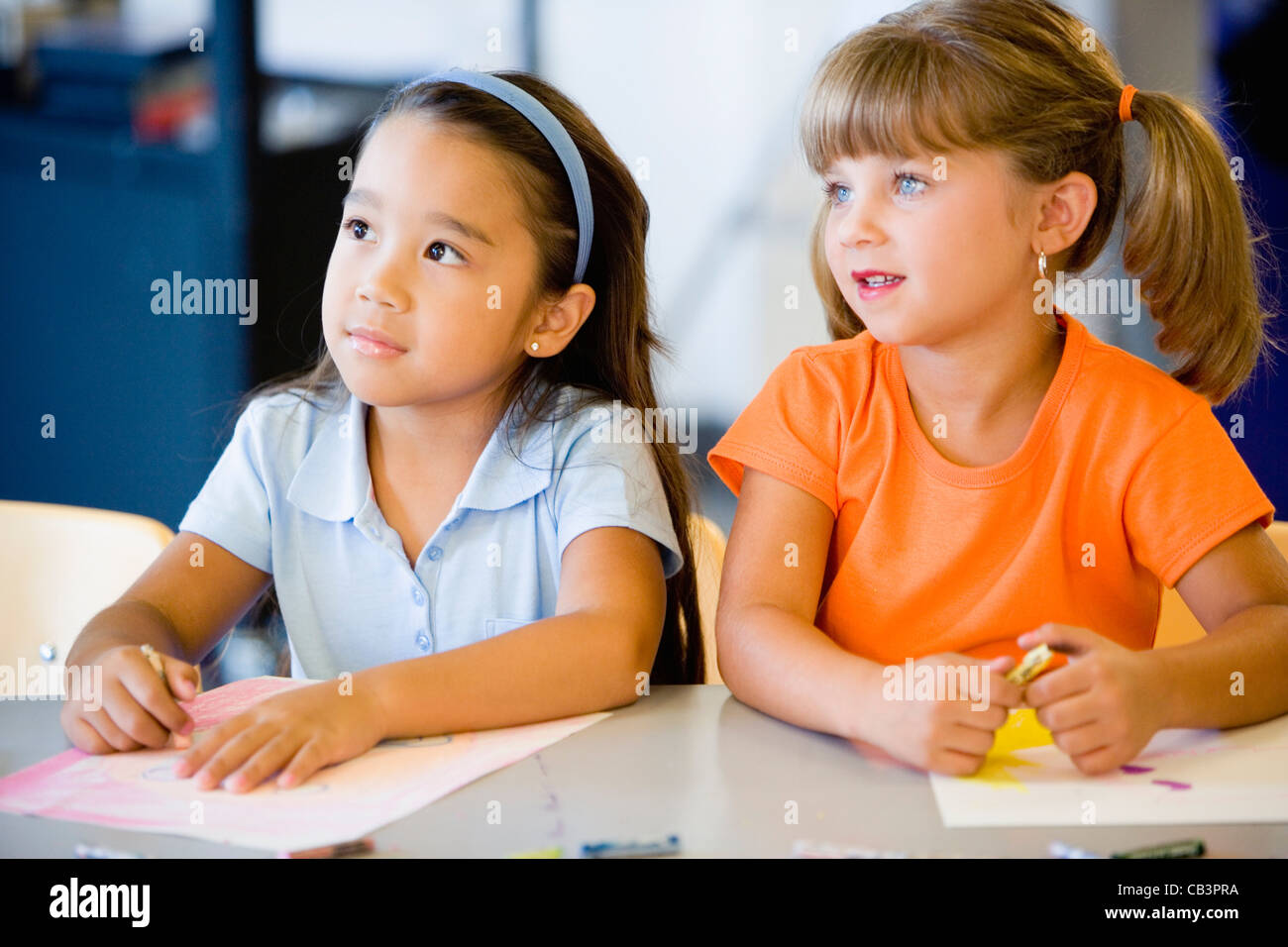 Two little girls coloring together Stock Photo - Alamy
