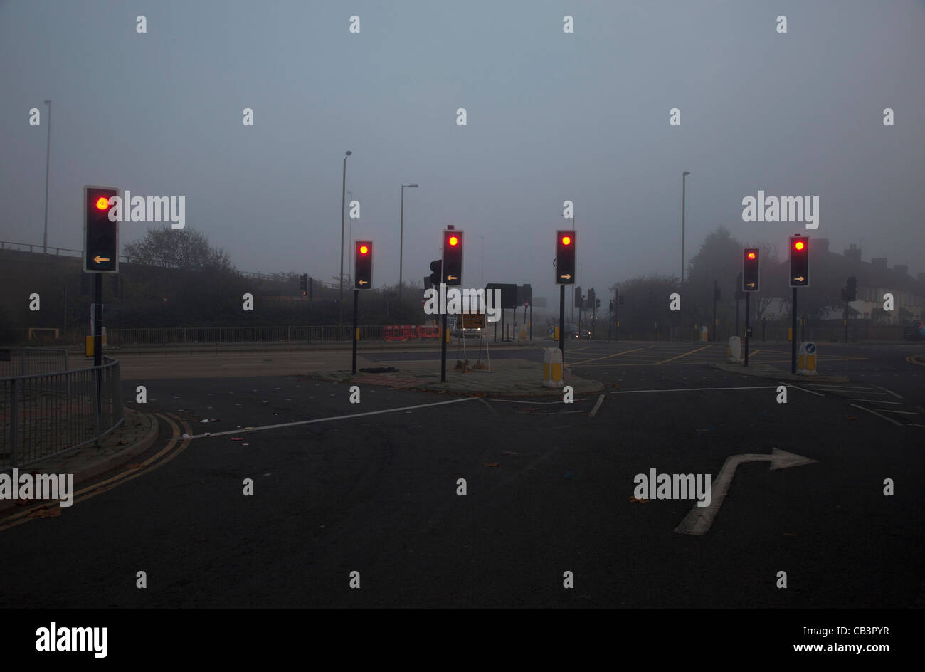 Thick fog at a junction with six traffic lights on red in London, UK ...