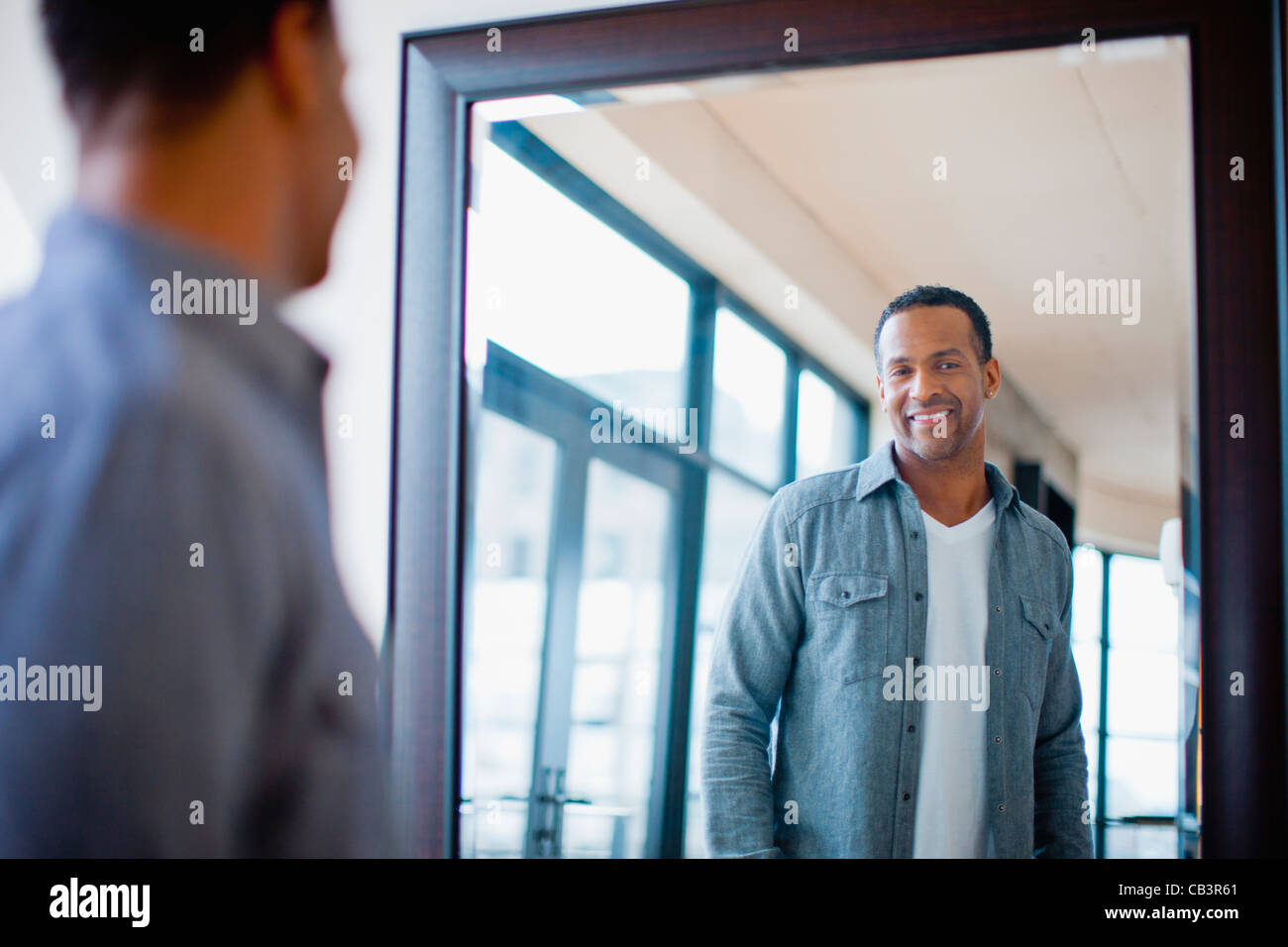 Man getting dressed Stock Photo - Alamy