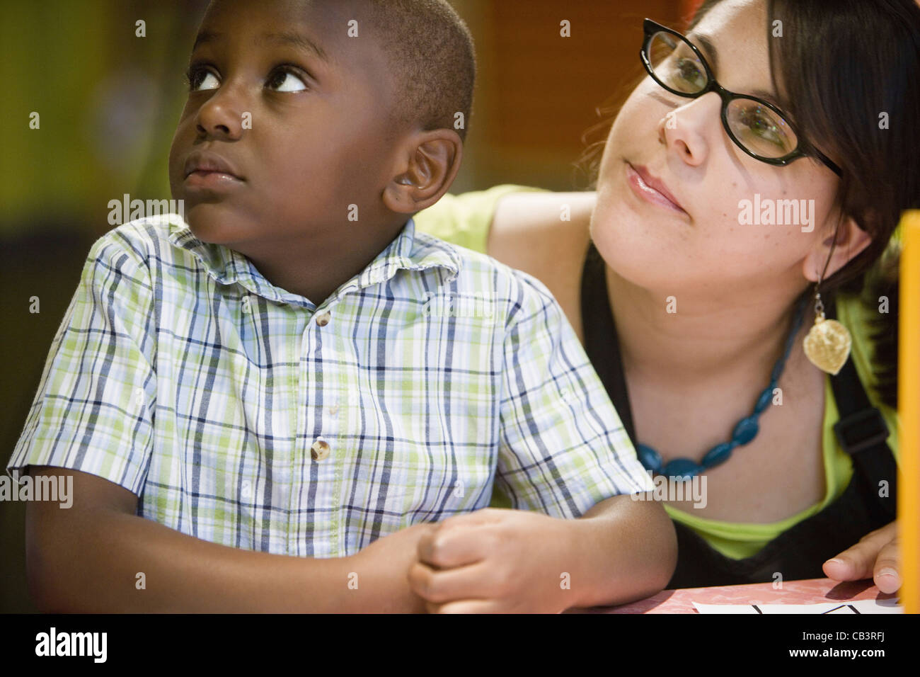 Teacher with student looking up Stock Photo - Alamy