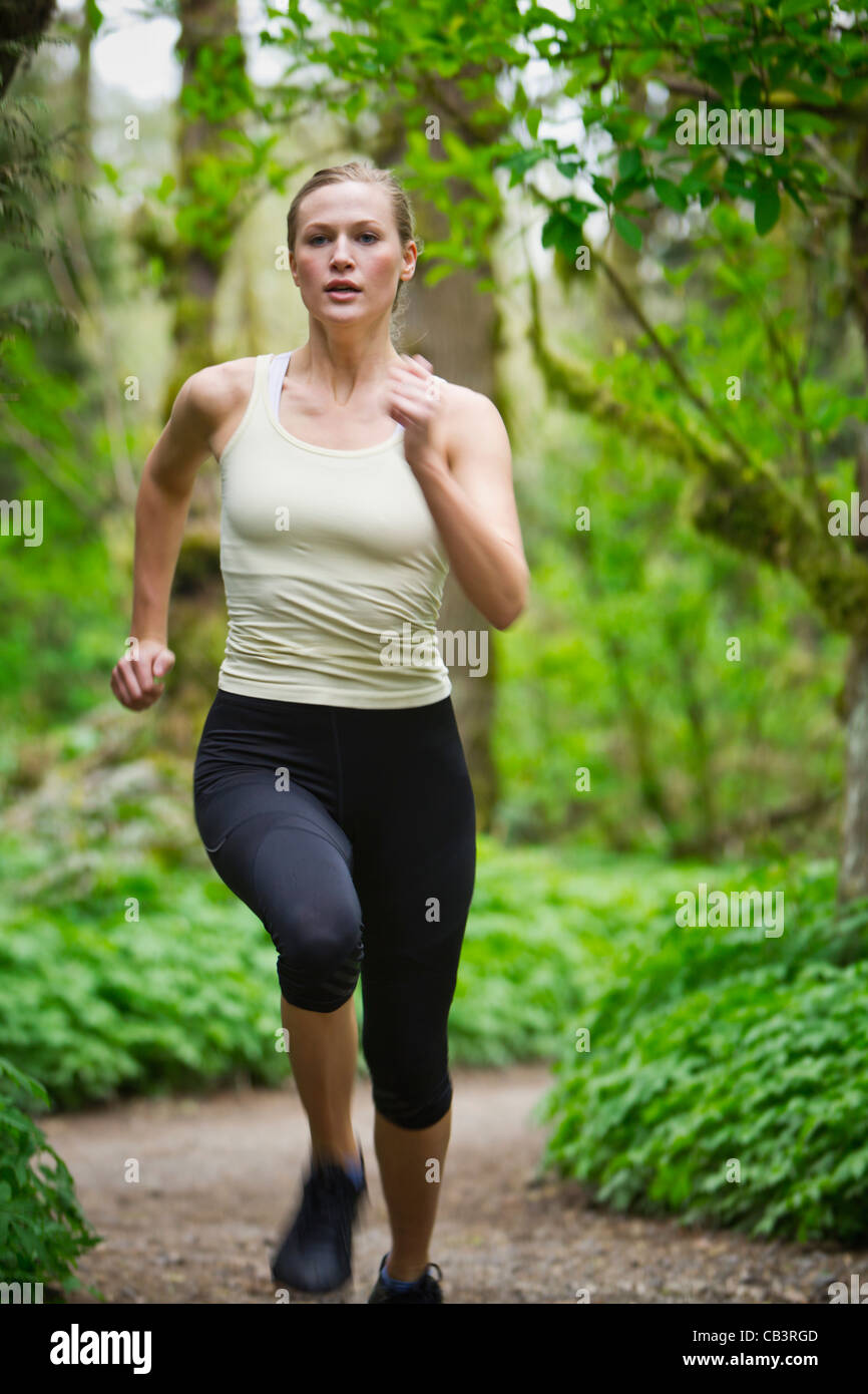 Portland, Oregon, USA, Woman trail running in forest Stock Photo - Alamy