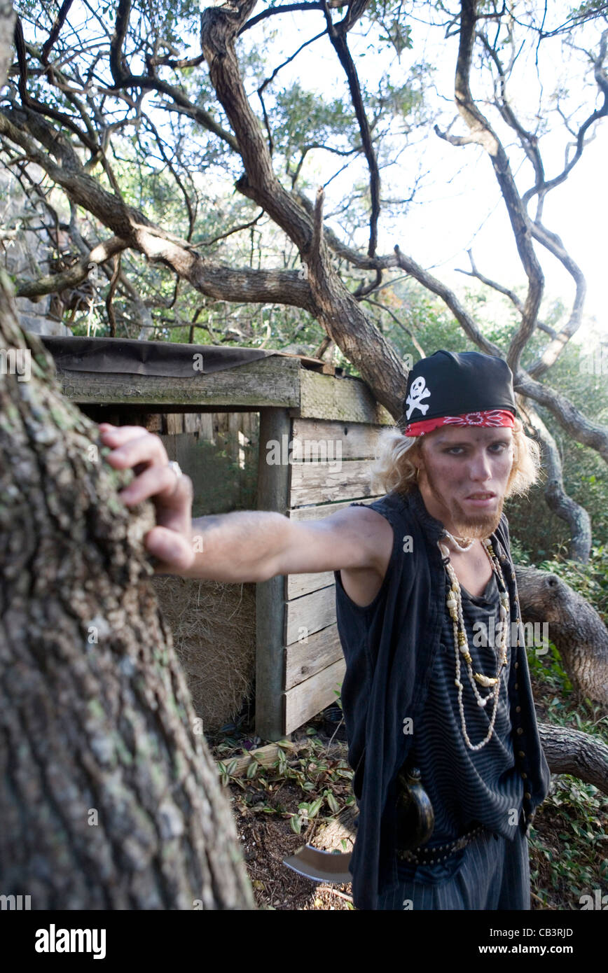 Portrait of a pirate standing near trees Stock Photo - Alamy