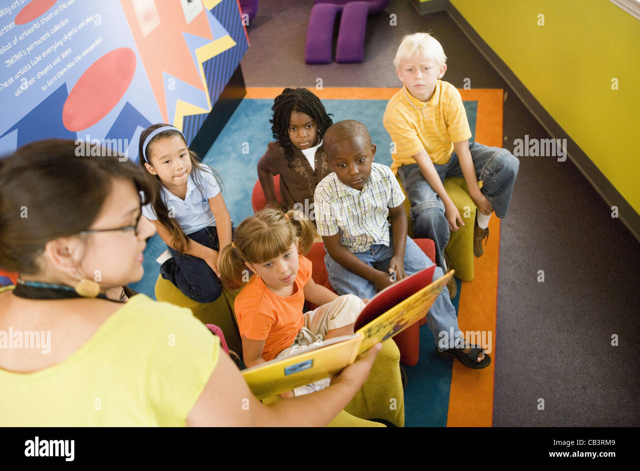 Boy standing front class reading hi-res stock photography and images ...