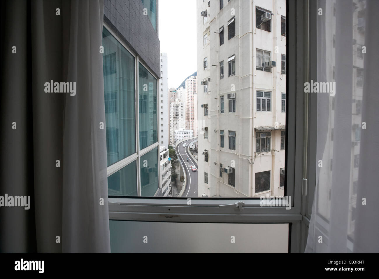 looking out from hotel window at high rise close proximity housing ...