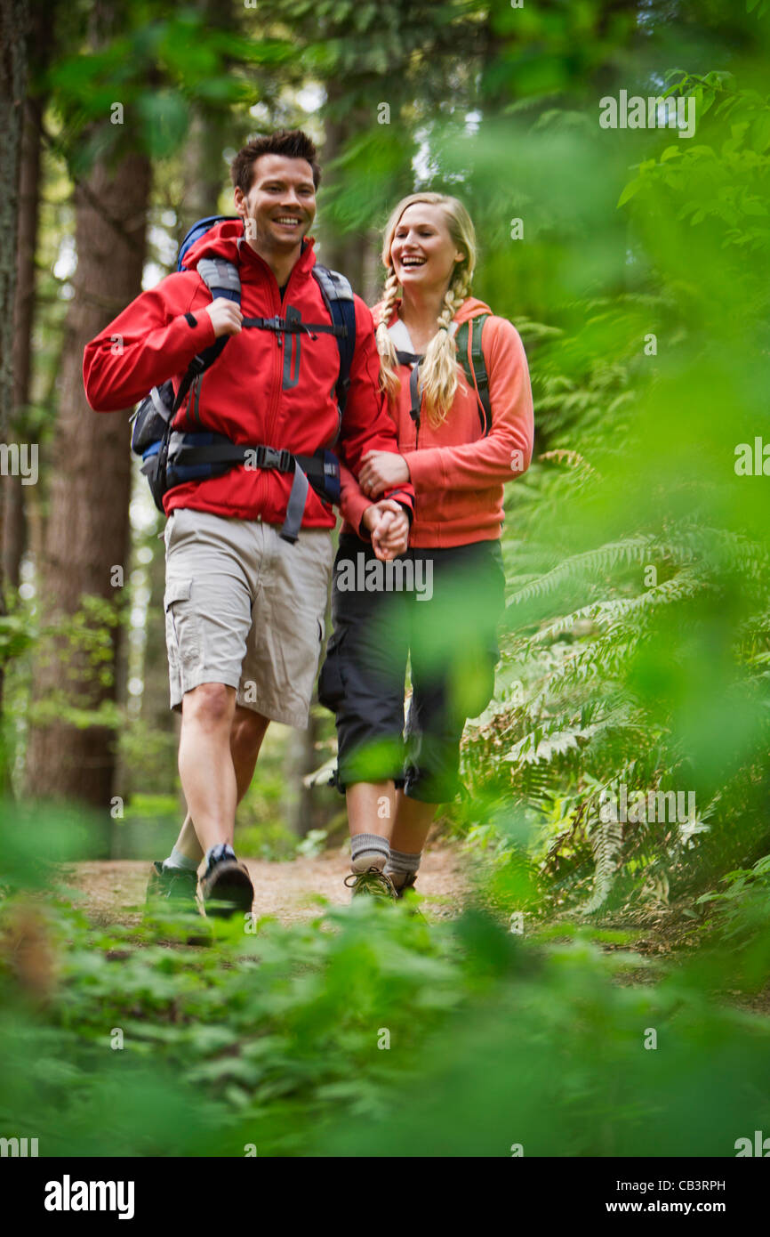 Portland, Oregon, USA, Couple walking on trail through forest Stock ...