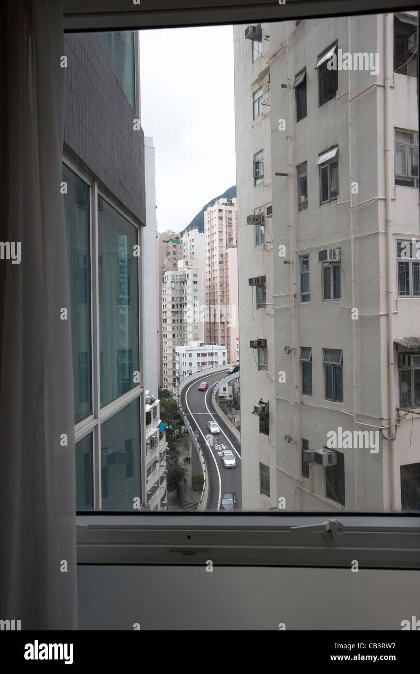 looking out from hotel window at high rise close proximity housing ...