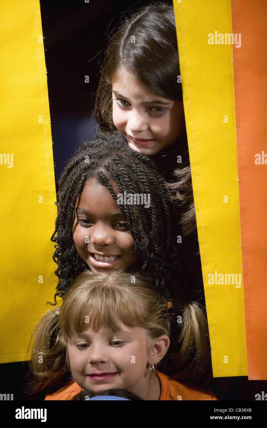 Kids heads from behind hi-res stock photography and images - Alamy
