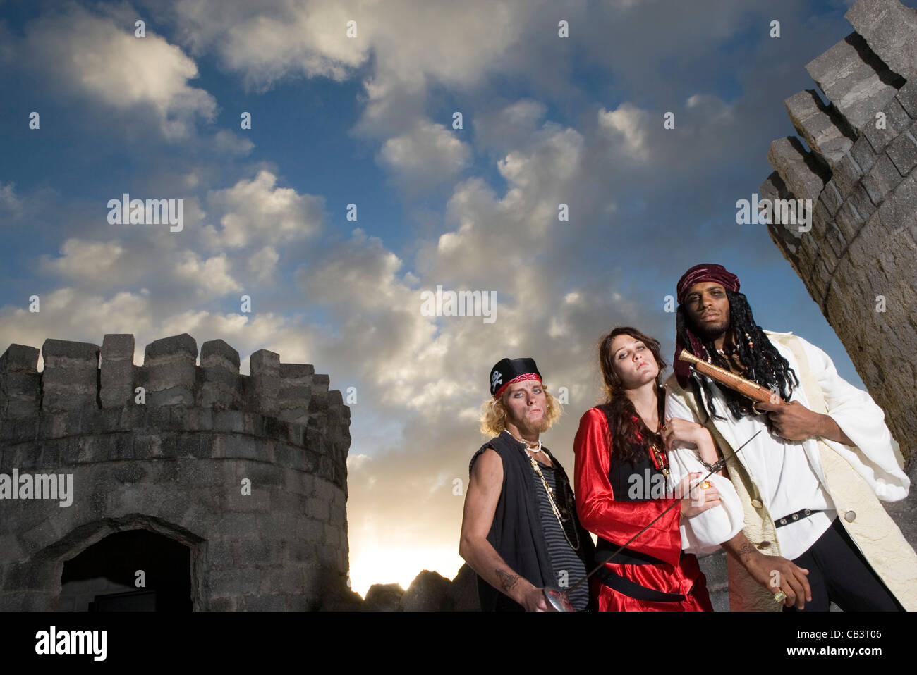Portrait of pirates armed with a pistol and a sword with castle turrets ...