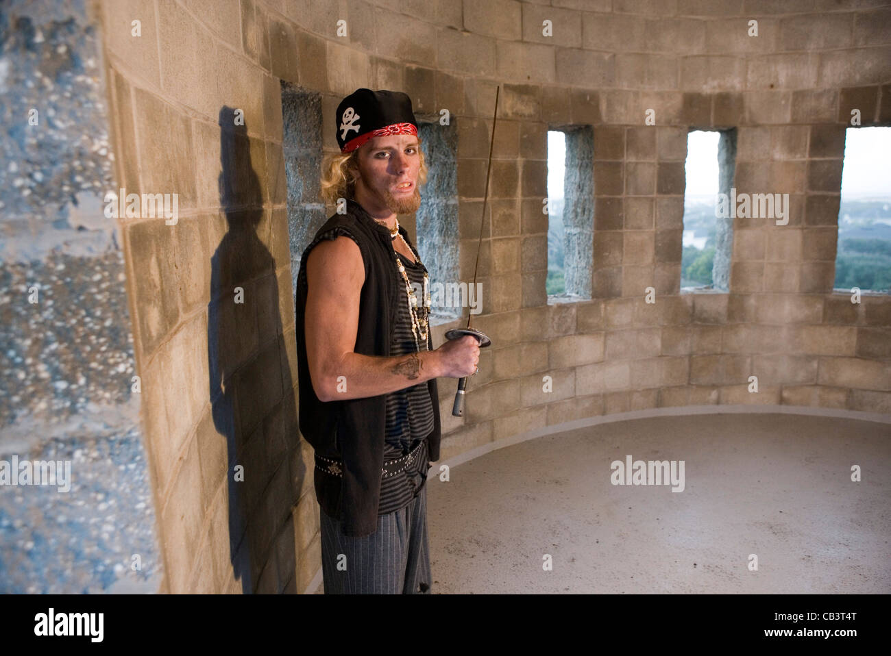Portrait of a pirate armed with a sword inside a castle turret Stock ...