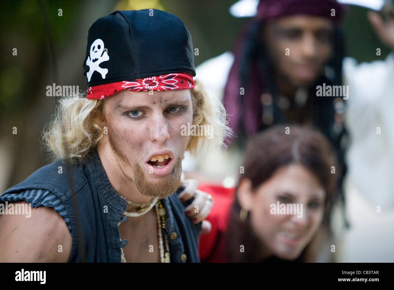 View of pirates armed with a gun and swords Stock Photo - Alamy