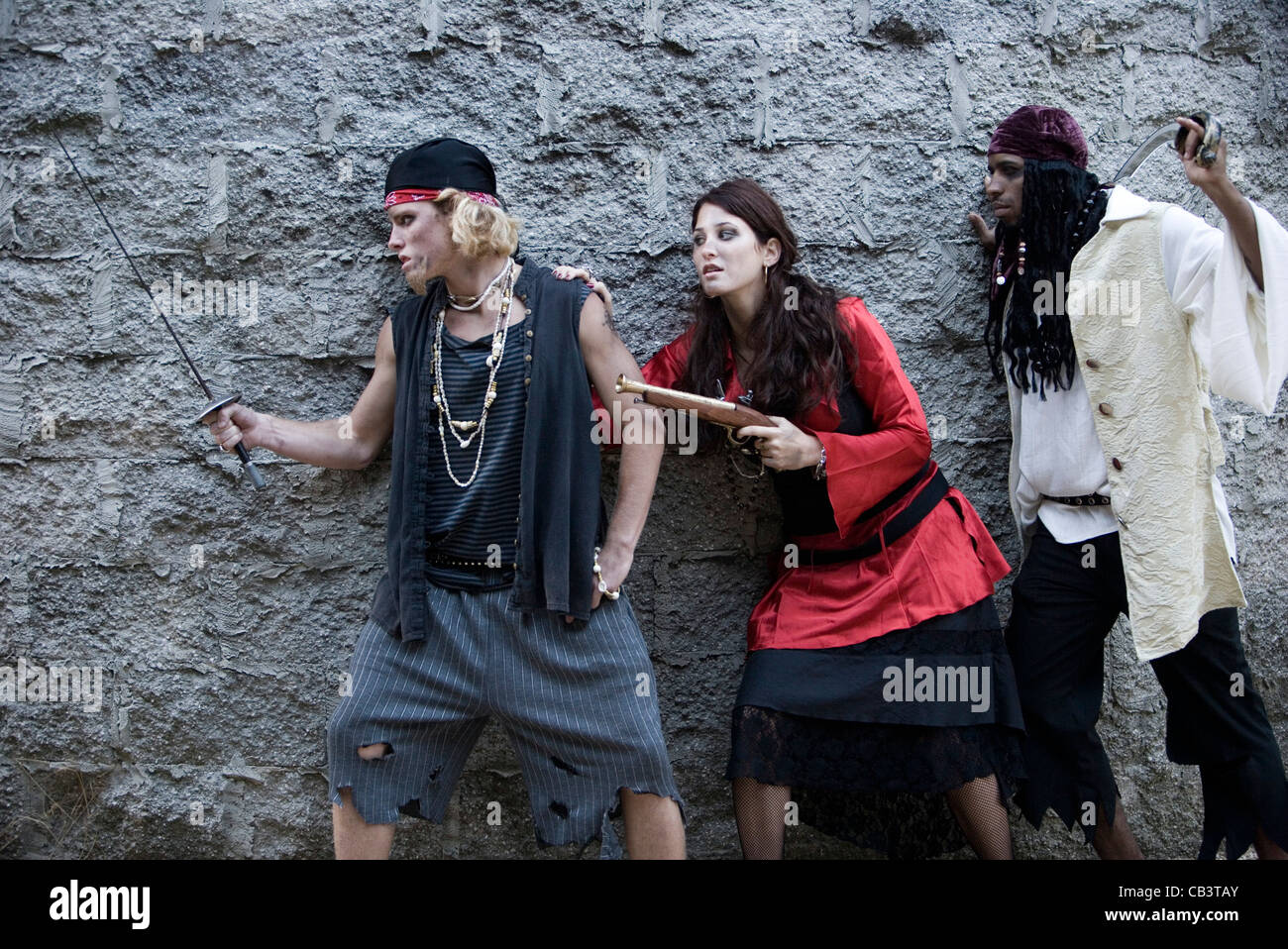View of armed pirates sneaking around a castle wall Stock Photo - Alamy