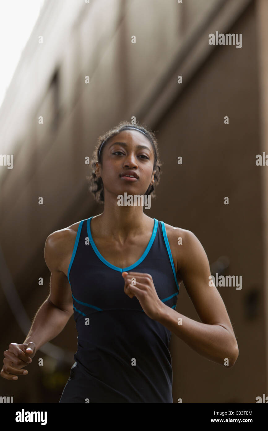 Portrait of woman jogging Stock Photo - Alamy