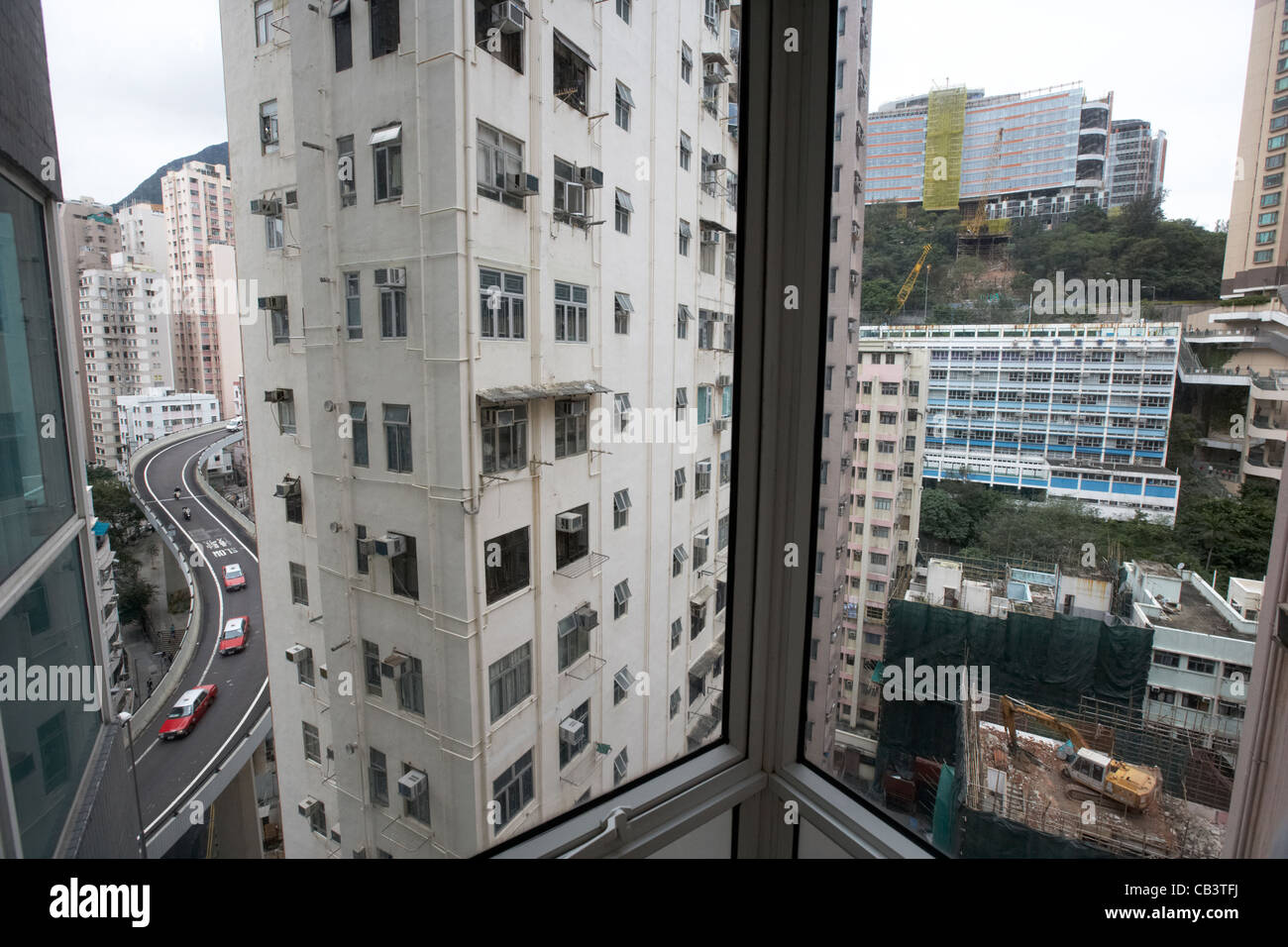 looking out from hotel window at high rise close proximity housing ...