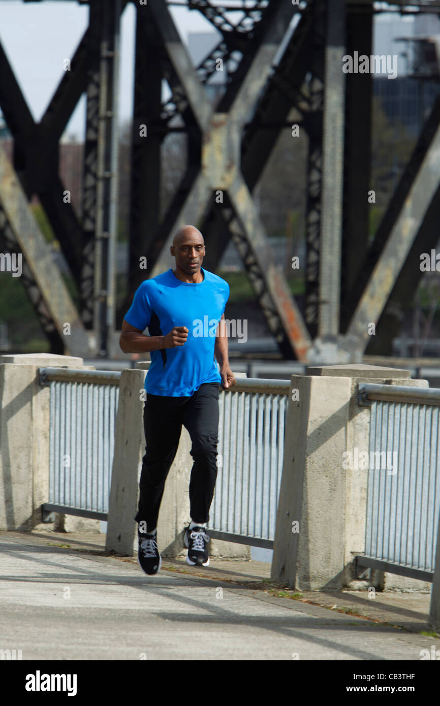 Man jogging in street Stock Photo - Alamy