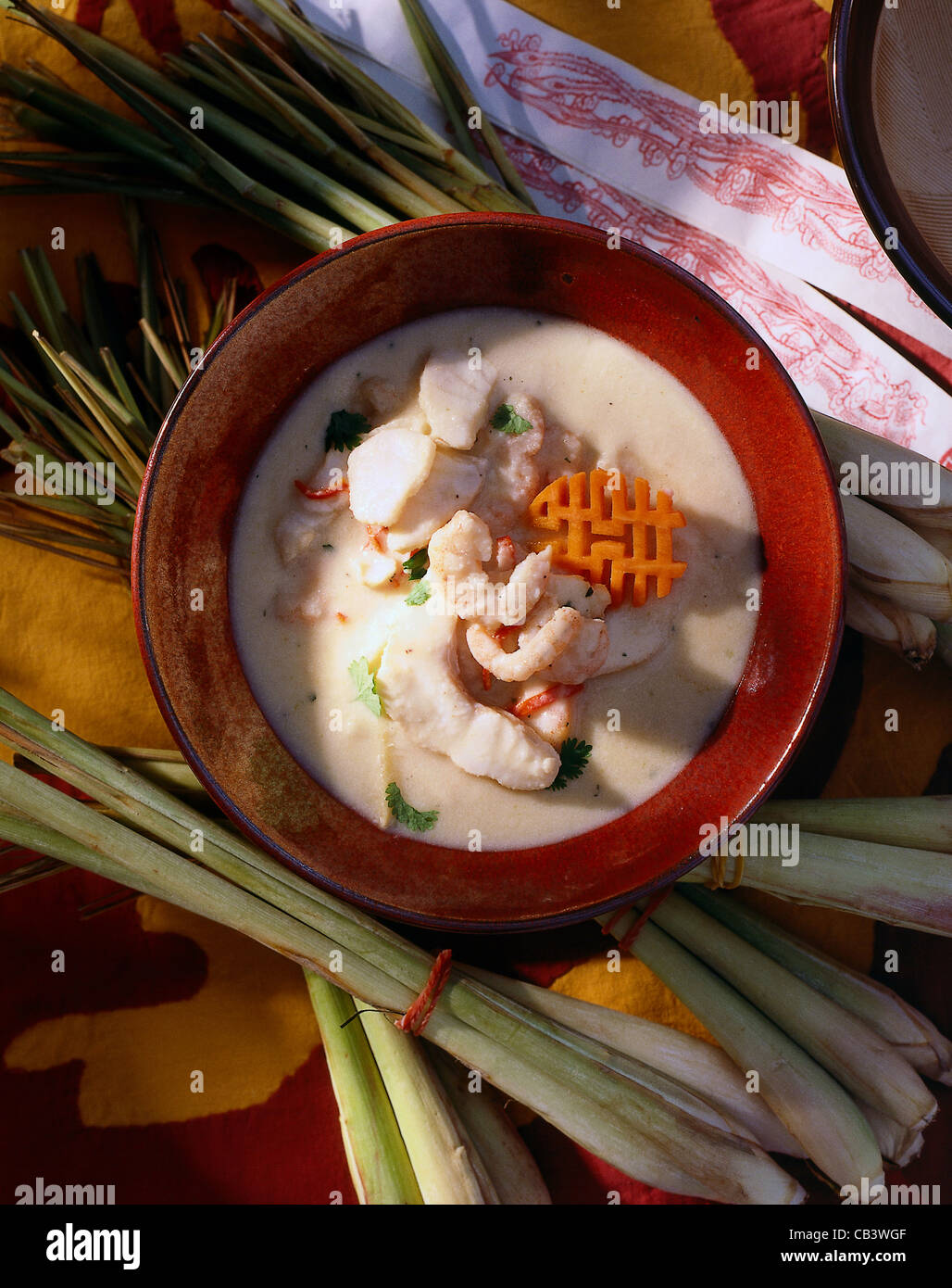Fish ragout in lemon grass sauce Stock Photo - Alamy