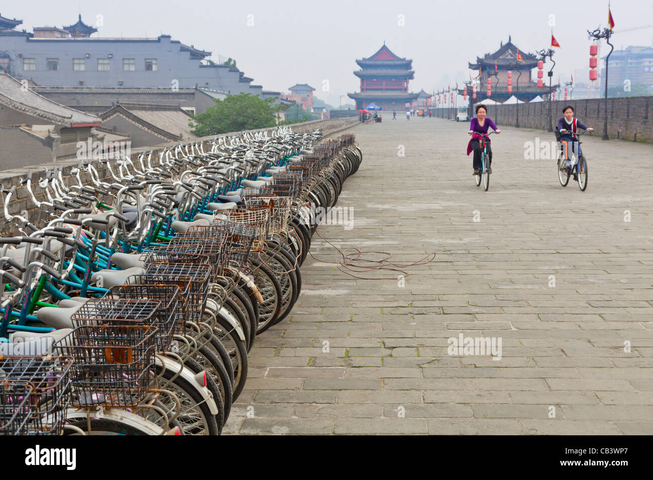 Bicycles for hire on the city walls around Xian Shaanxi Province, PRC ...