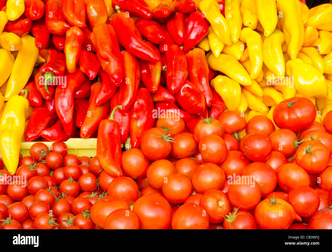Colorful peppers and tomatoes on display at the farmers market Stock ...