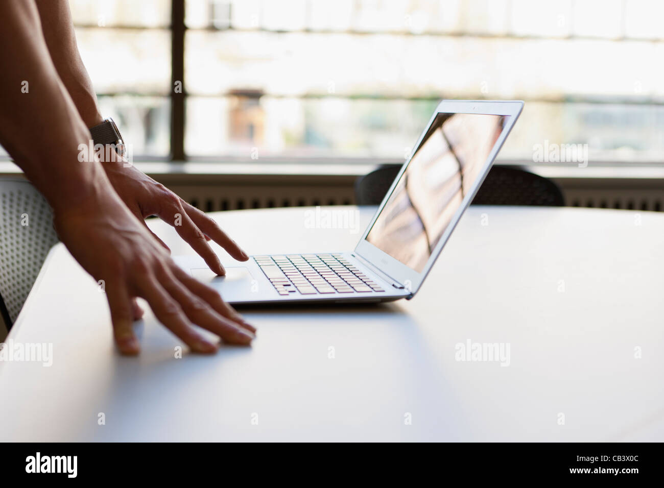 Man's hands on computer Stock Photo - Alamy