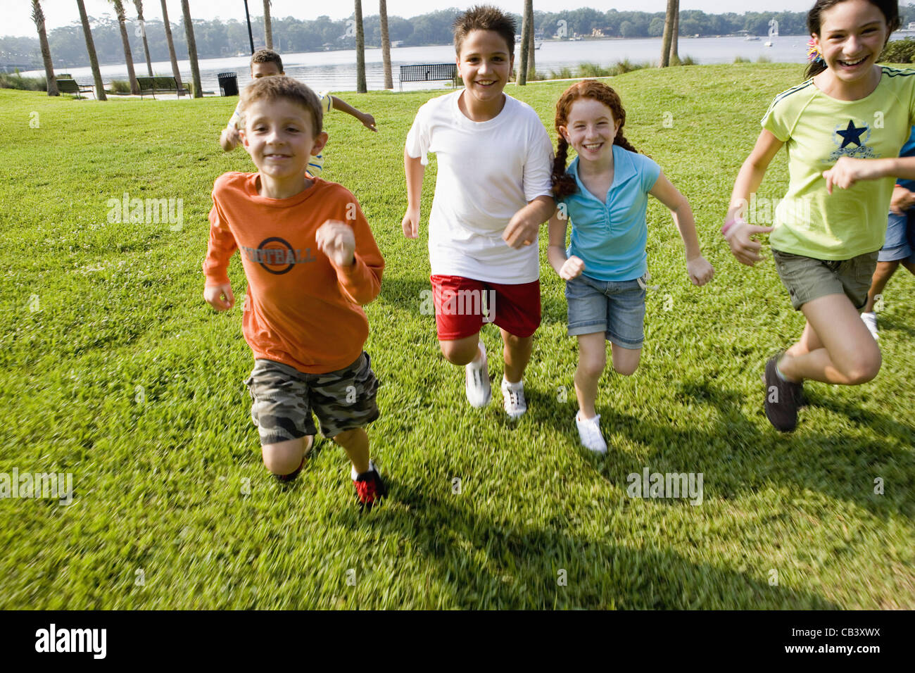 Children running towards the viewer Stock Photo - Alamy