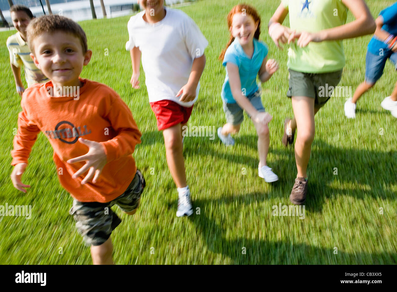 Children running towards the viewer Stock Photo - Alamy