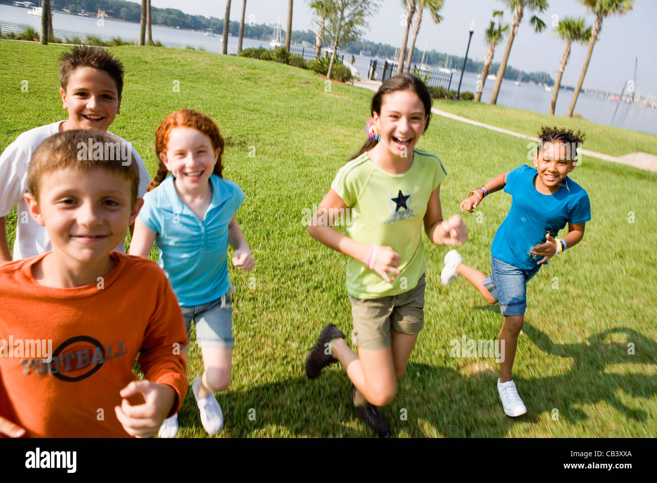 Children running towards the viewer Stock Photo - Alamy