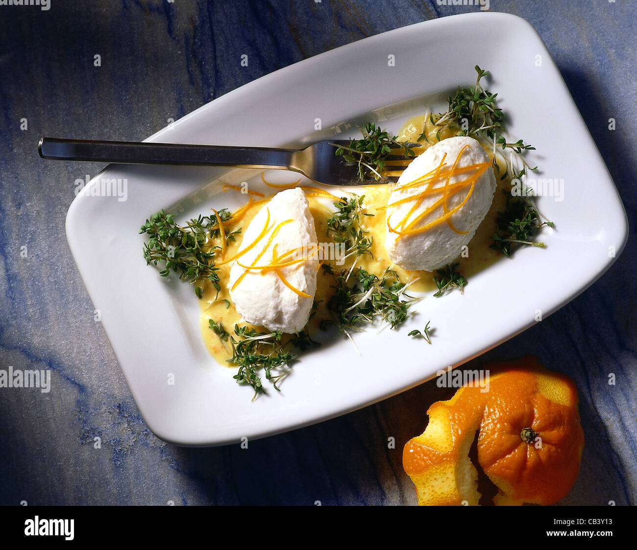 Fish dumplings with orange sauce Stock Photo - Alamy