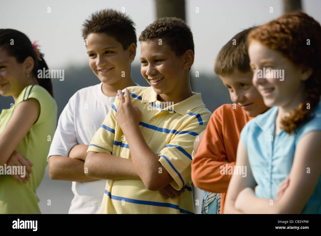 Children outdoors standing side by side Stock Photo - Alamy