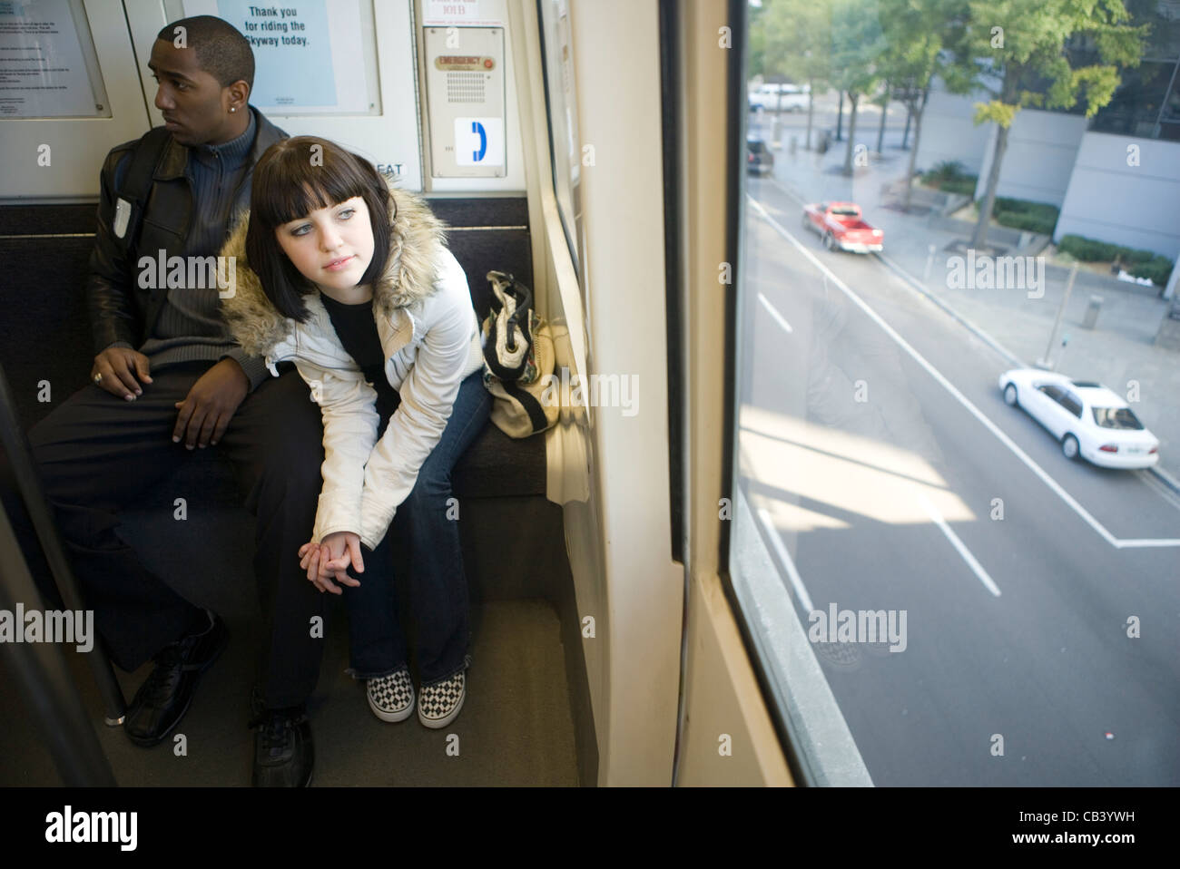 People riding a train Stock Photo - Alamy
