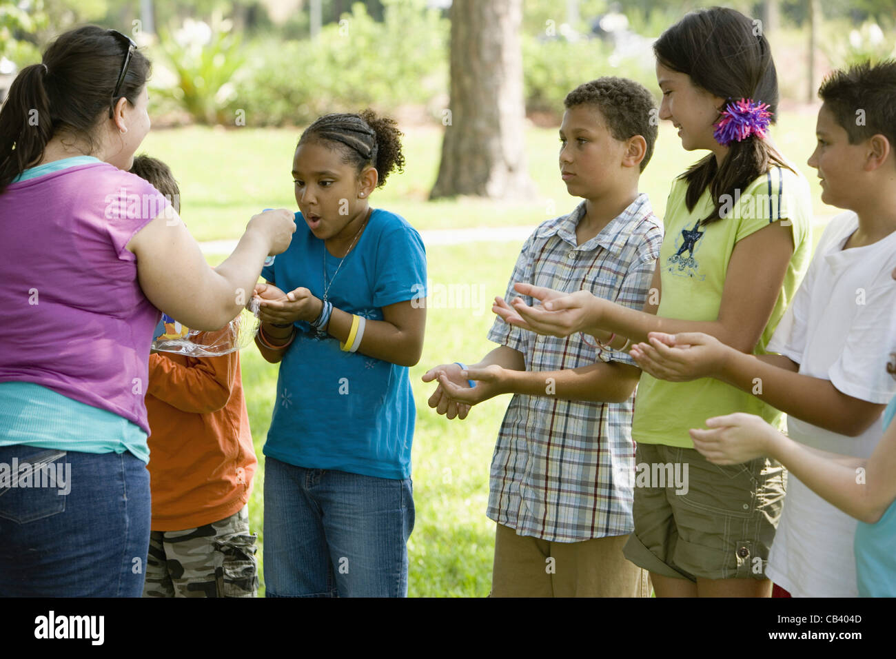 Children waiting eagerly in line Stock Photo - Alamy