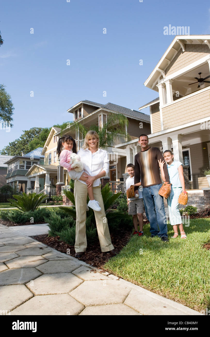 Portrait of a family in front of their house Stock Photo - Alamy