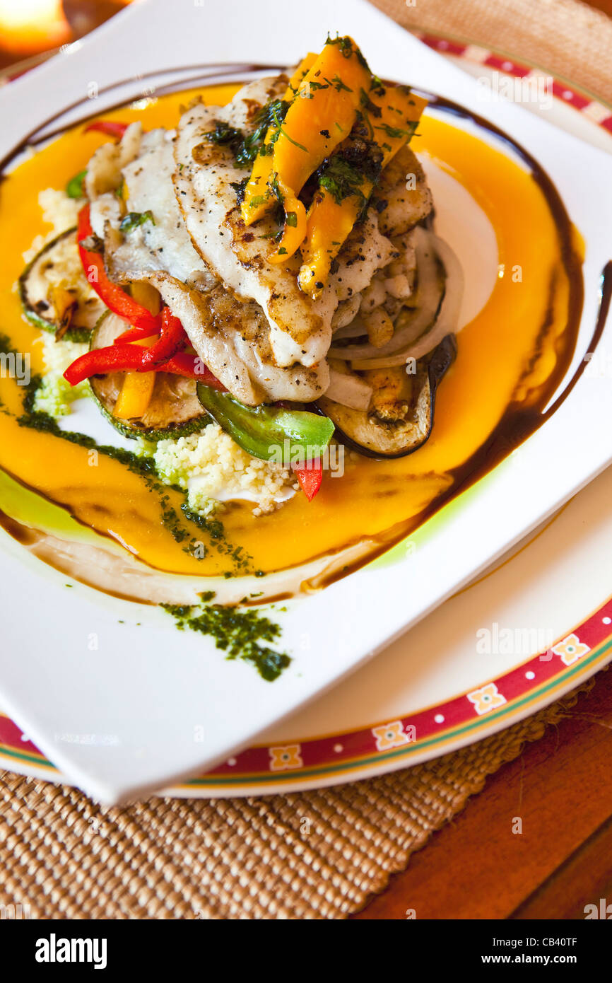 Mexico, Yucatecan, close up of Mayan fish with peppers, papaya and ...