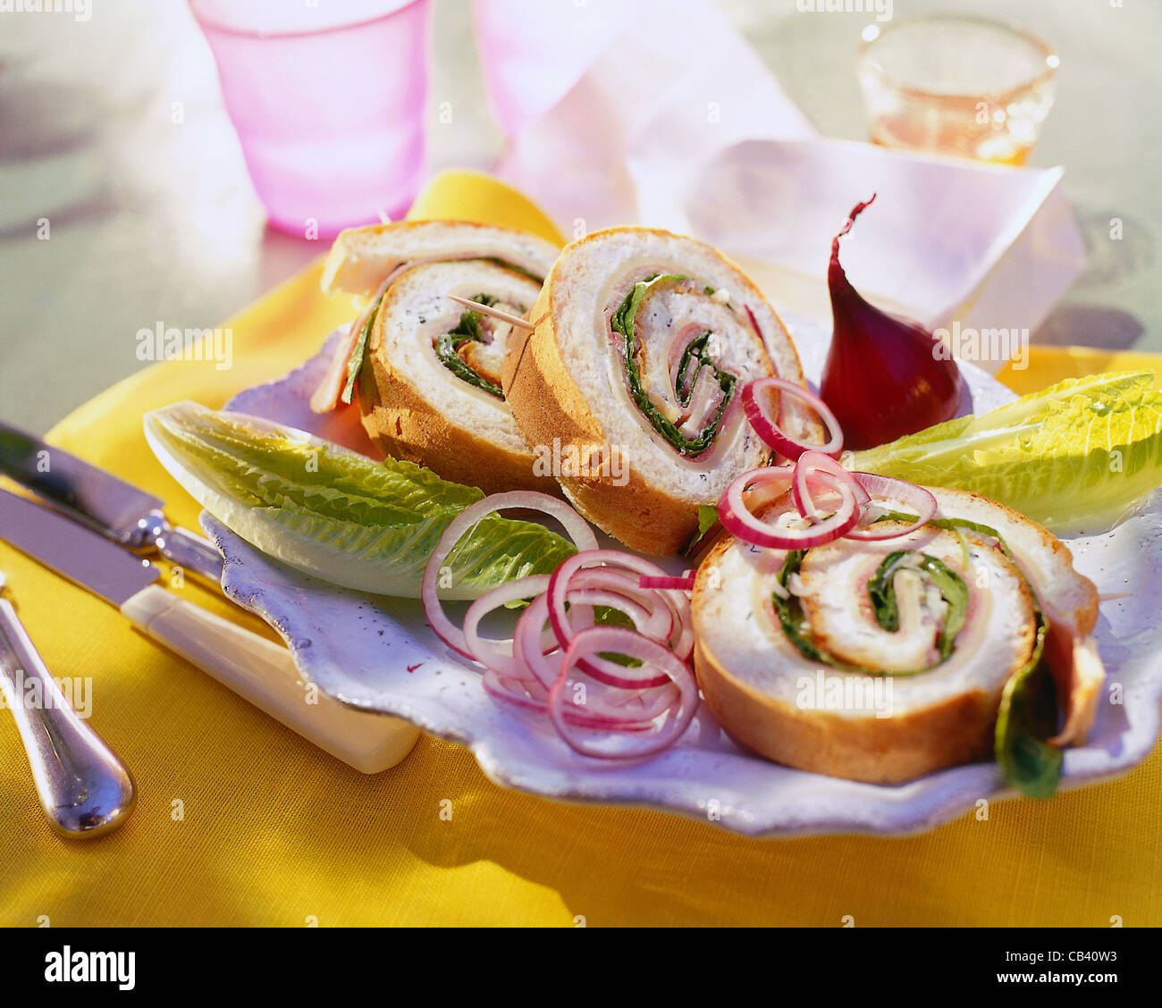 Roulade of white bread filled with ham, cheese and romana lettuce Stock ...