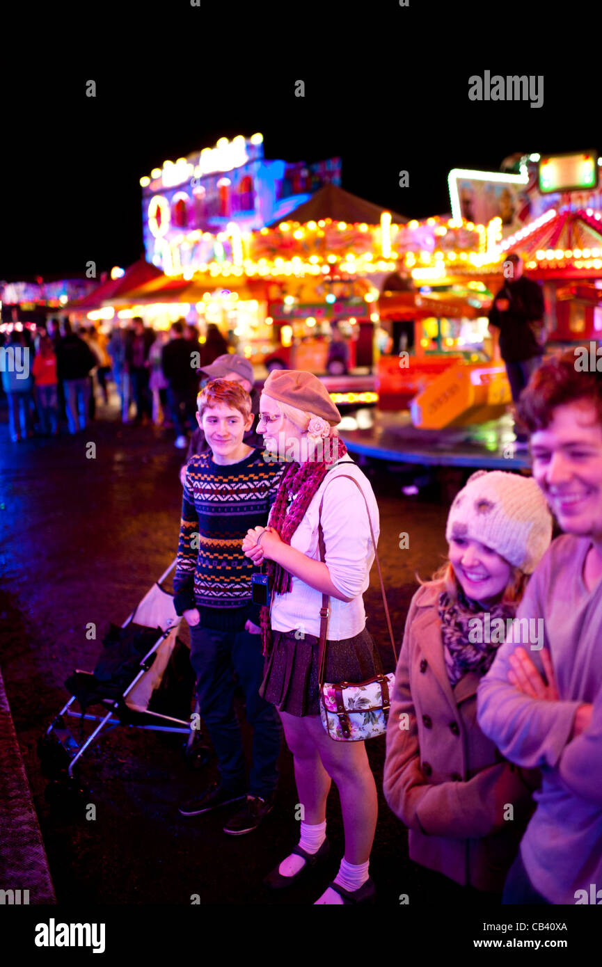 Young People looking entranced at the lights and sounds of the ...